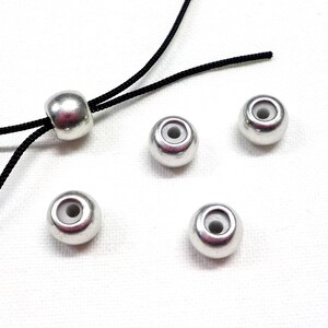 Silver Stopper Beads With Rubber Tube, Slider Stopper Beads, Smart Bead ...