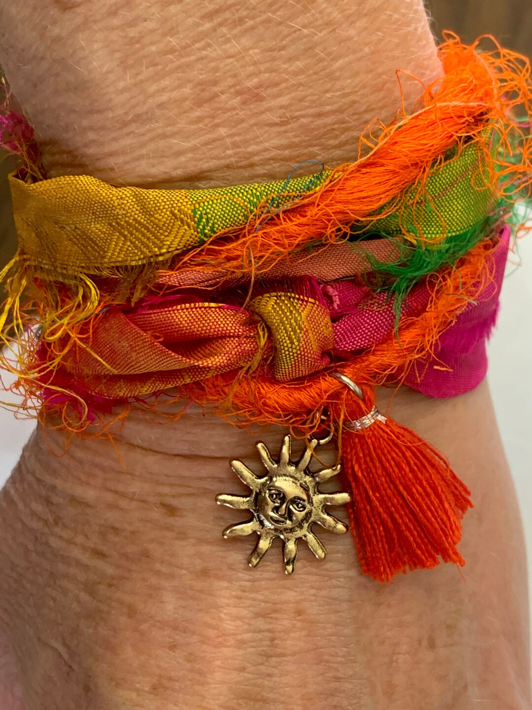 Bracelet Silk Sari Ribbon and Yarn. Multi Color. Sun Emblem and Red ...