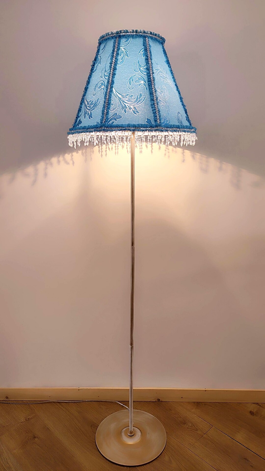 A Victorian-style Floor Lamp With a Blue Shade for Rest and Relaxation ...