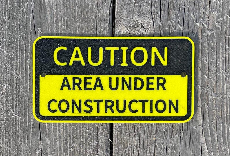 Small "caution Area Under Construction" Sign Vibrant Yellow With Black ...