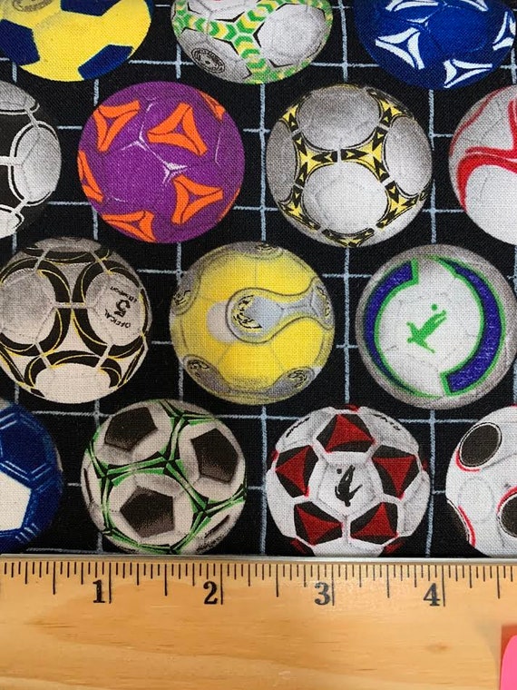 Fabric Colorful soccer balls all over black and white grid Fabric by ...