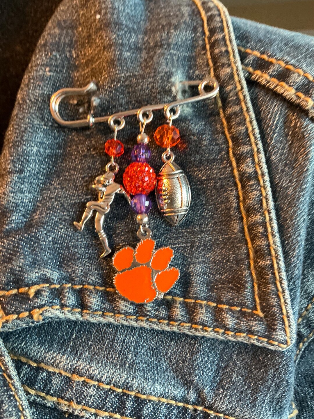 Clemson University Silver Safety Pin. There is an Clemson Tiger Paw, a ...