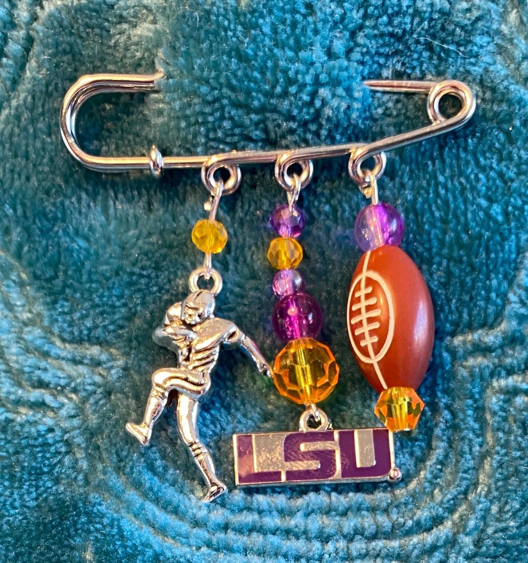 LSU Tigers Football Safety Pin. There is a LSU Charm, a Football and a ...