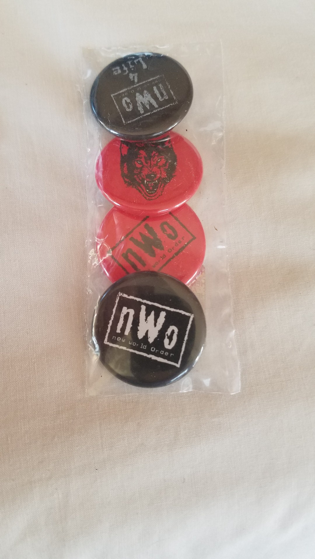 Set of 4 WWE NWO New World Order Red Black Pin Set New in Package 1-1/4 ...