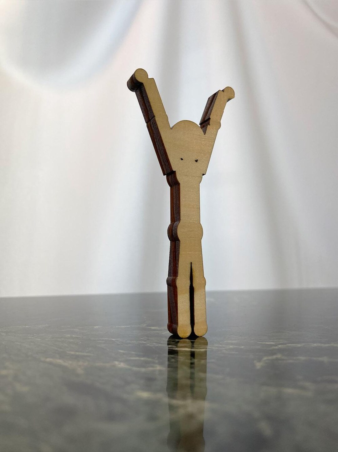 Triumphant Gymnast – A Gymnast Mid-victory Pose, Arms Raised in ...