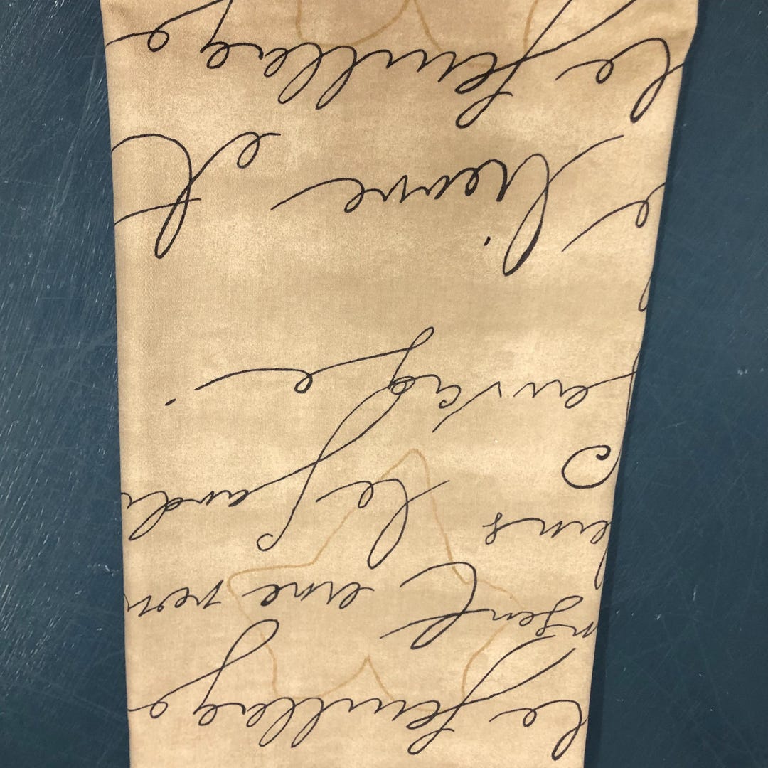 Simple Cotton Print With Cursive Writing in Black on Tan Background ...