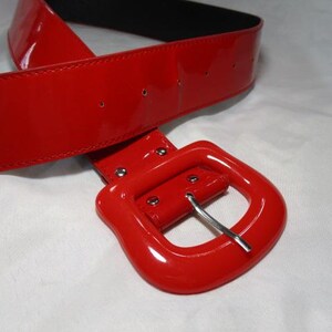 A 1990's Shiny, Bright Red Vinyl Patent Leather-like Belt With a Lucite ...