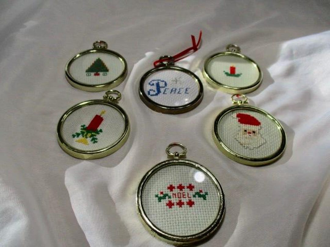 A Six Piece Set of Handmade Cross Stitched 2 1/2" Round Christmas ...