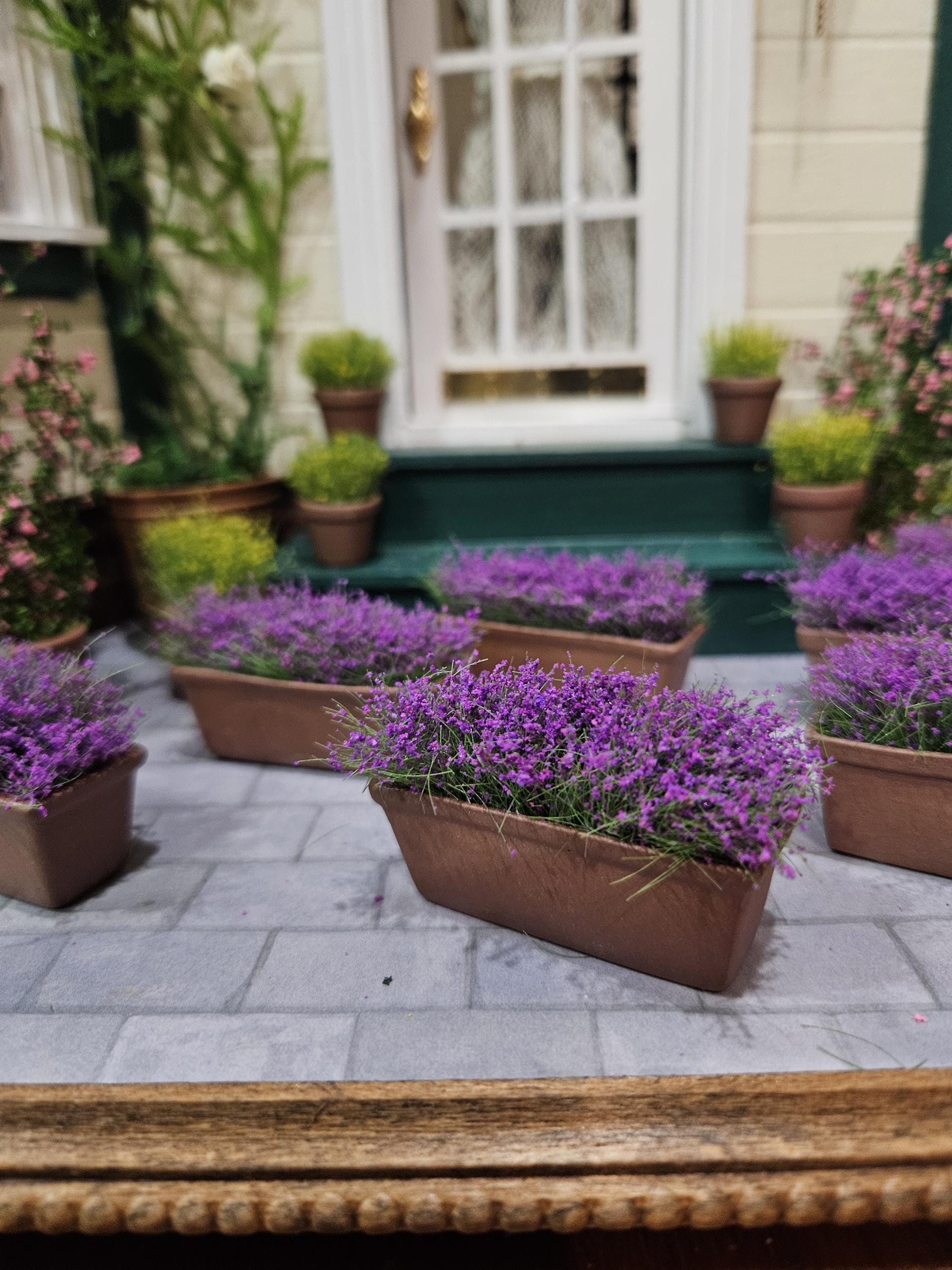 Beautiful Lavender Flowers or Soft Pink Blossoms in Dark Brown Window ...