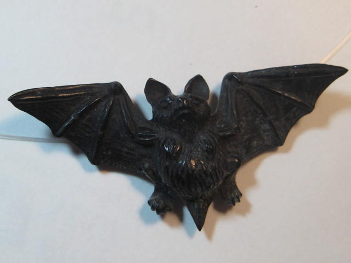 Carved Jet Bat Bead ................... Fully Carved .... 56 X 27 X 10 ...