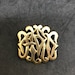 M. Jent Gold Monogram Style Brooch Intertwined Ribbon Gothic Style ...