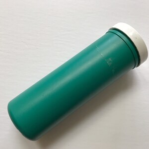 1990s Blank Back Pogs in Collector Tube Magic 8 Ball Skulls Peace Signs ...