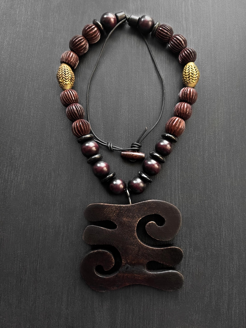 African Tribal Adinkra Symbol Pendant Necklace: Gyawu Atiko Wood Symbol ...