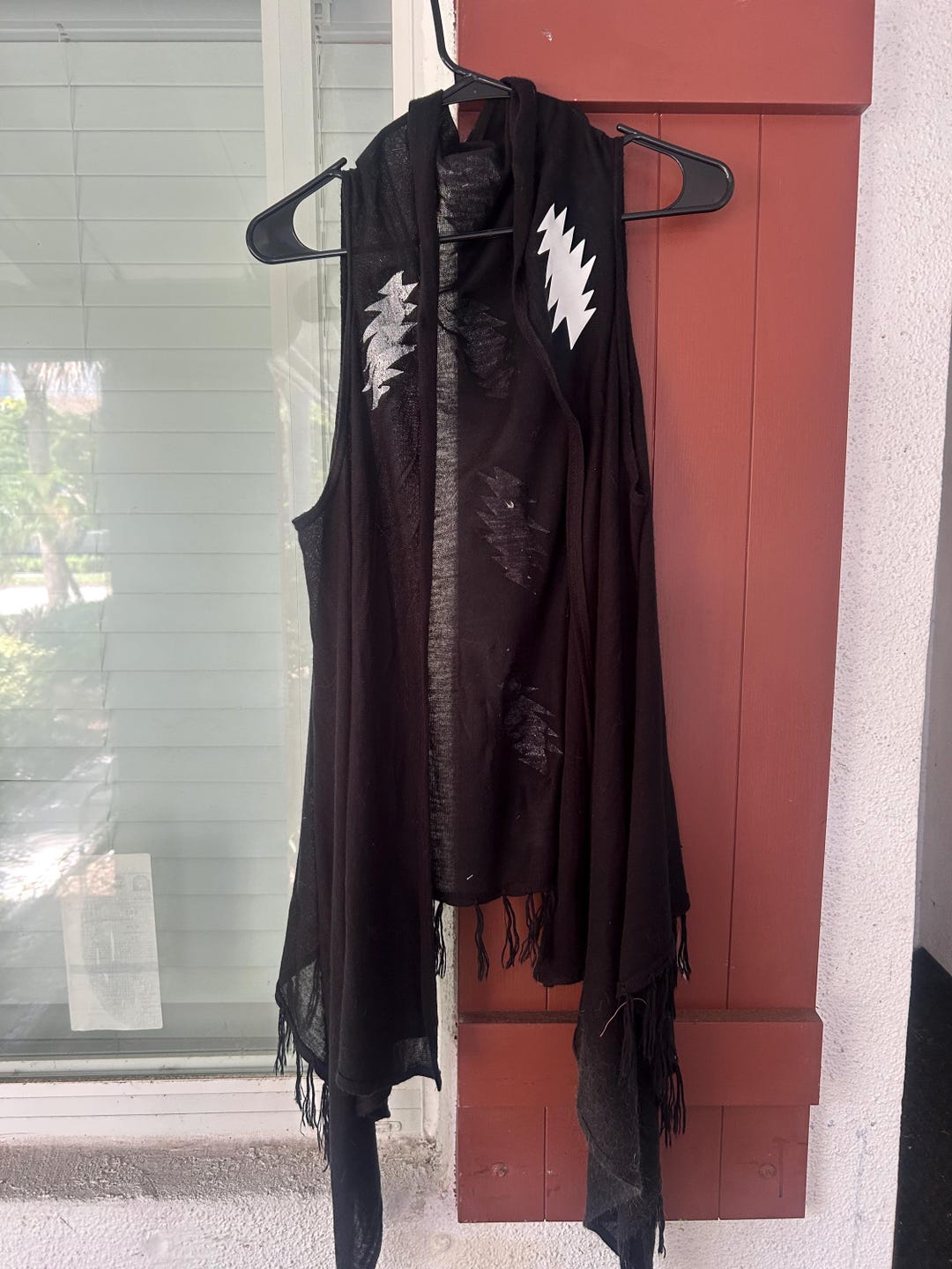Black Flowy Vest With Gd Bolts on Front Sides and Down the Back One ...