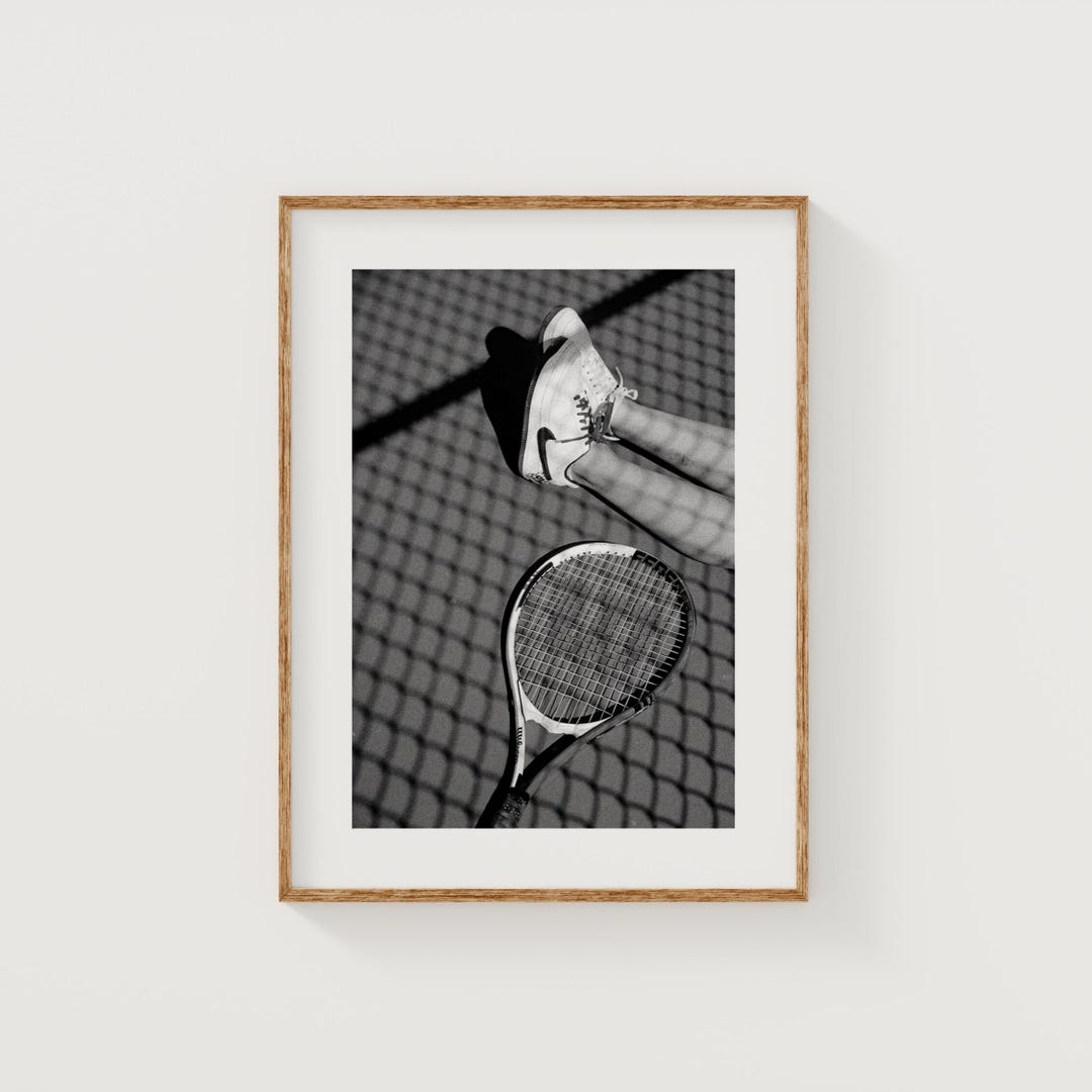 Person's Feet Next to Tennis Racket Black and White Photo Instant ...