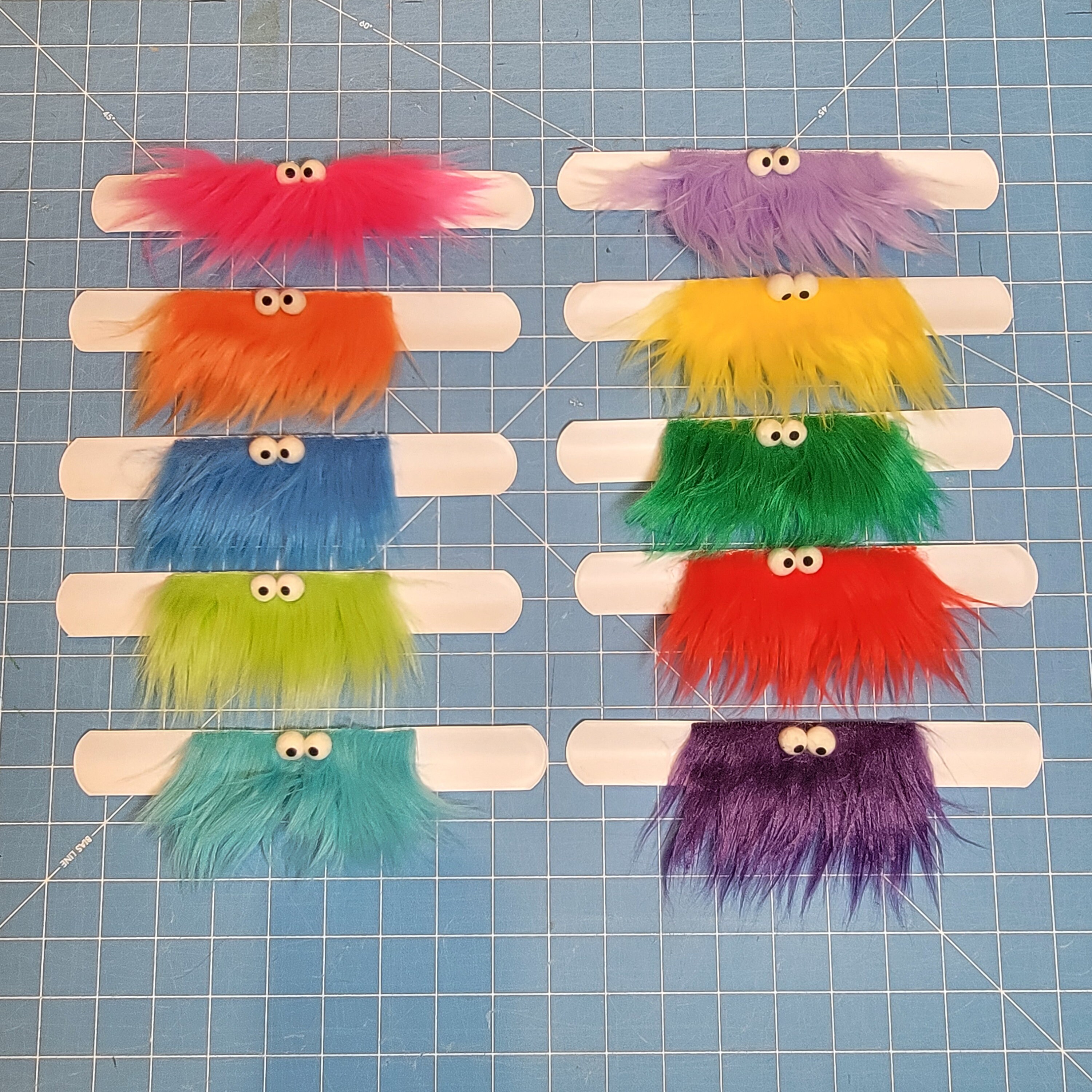 Fuzzy Facelets - Slap Bracelets With Character From All Hands ...