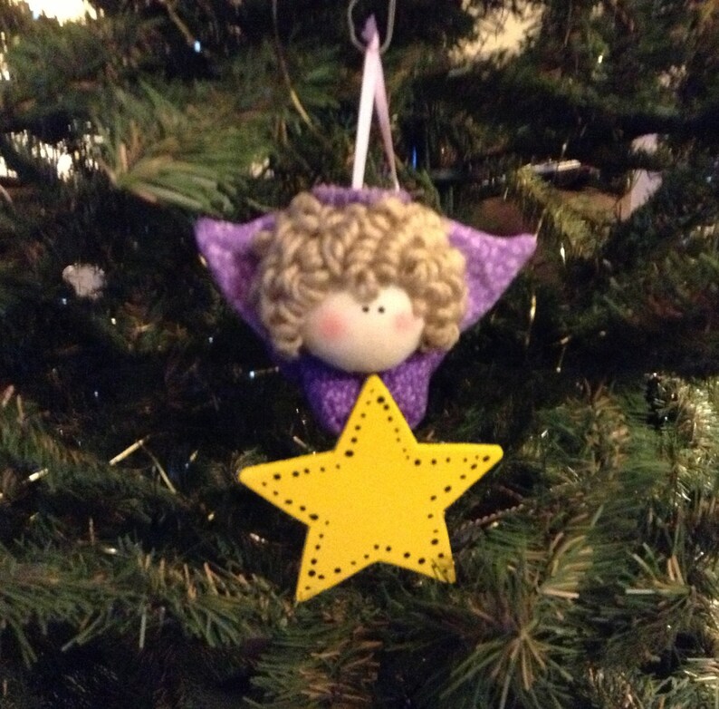 Primitive Sandy Blonde Angel With Purple Body and Purple Wings Holding ...