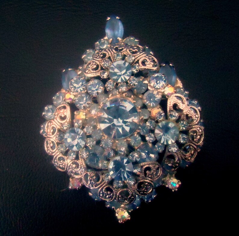 Delizza and Elster A/k/a Juliana Blue Topaz Chaton and Silver Scroll ...