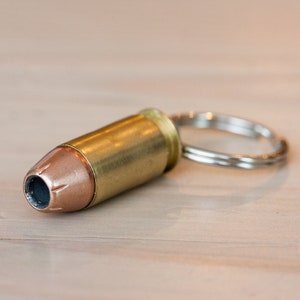 BULLET KEYCHAIN - Real .45 Caliber Hollow Point Bullet Key Chain ...