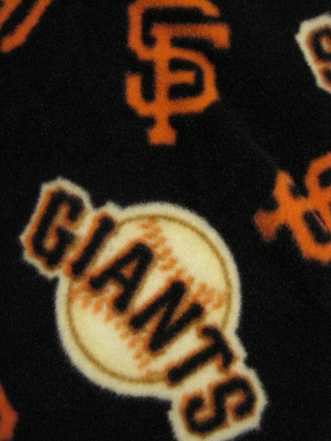 San Francisco Giants Baseball Team Logos and Emblems Scattered on Black ...