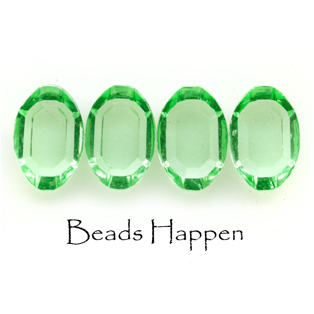 SWAROVSKI 12x8mm Oval Channel Cut Peridot Green Faceted Oval Stones ...