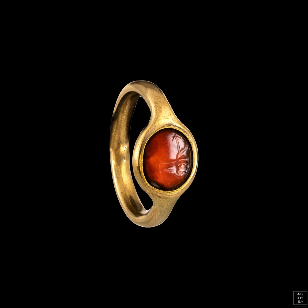A Gold Ring Set With an Italic Carnelian Intaglio. Hand With Attributes ...