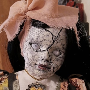 smashed face doll