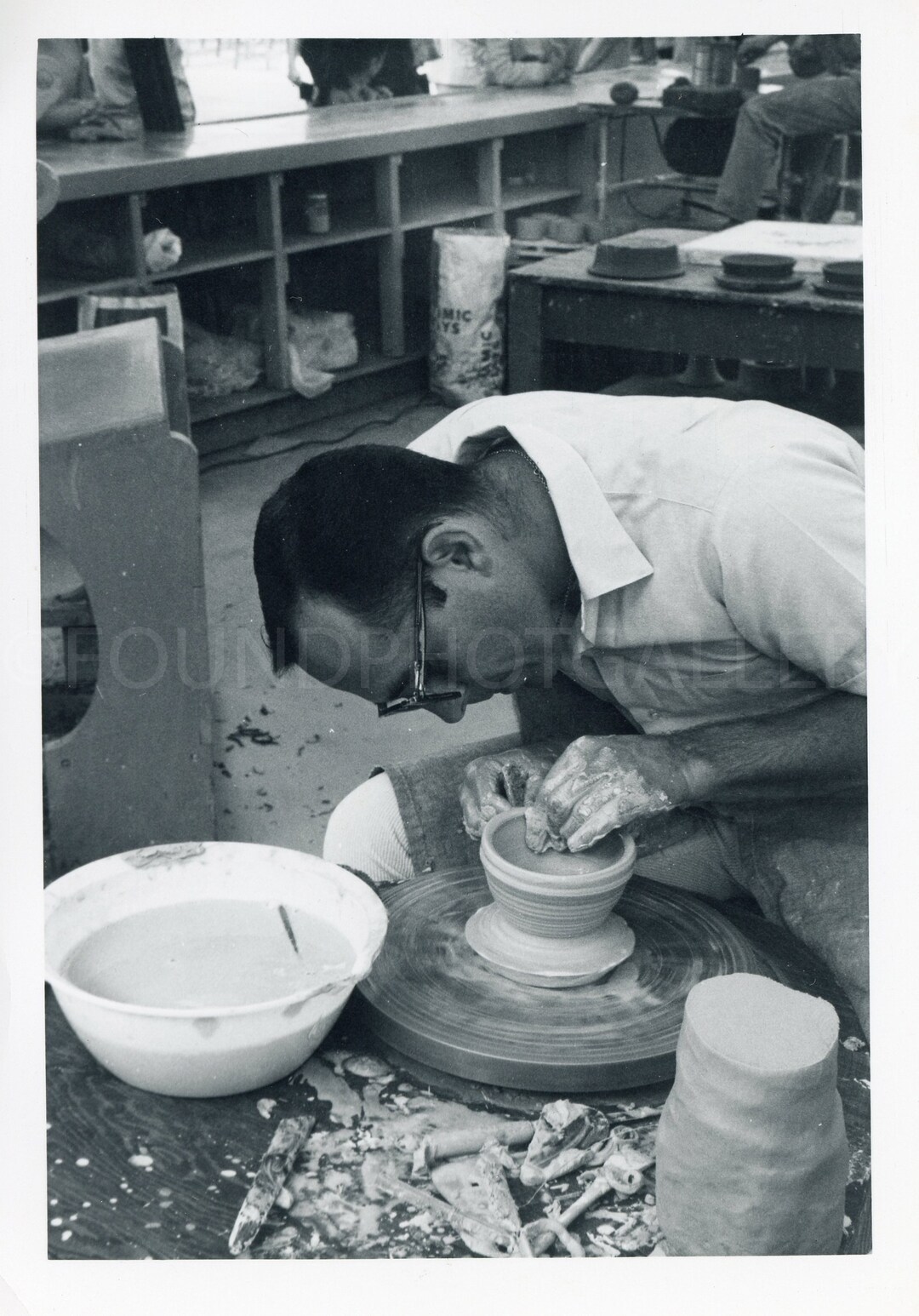 Man Spinning Pot on Potters Wheel in Ceramic Studio Photo, Vintage ...