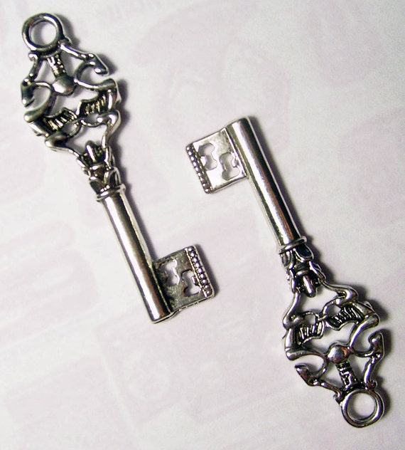 Items similar to 2 antiqued silver skeleton keys vintage style charms ...
