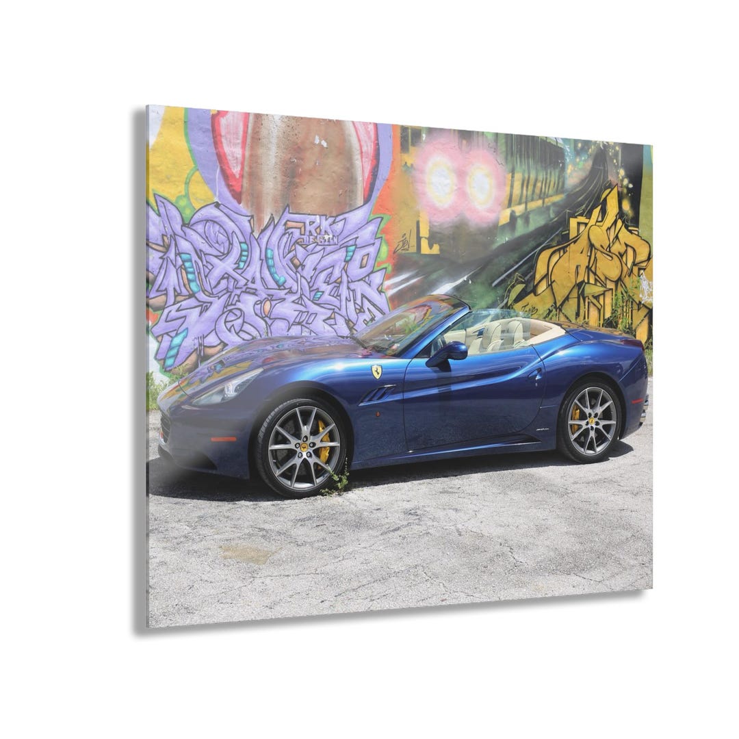 Ferrari California in Deep Ocean Blue, Captured Against a Vibrant Urban ...