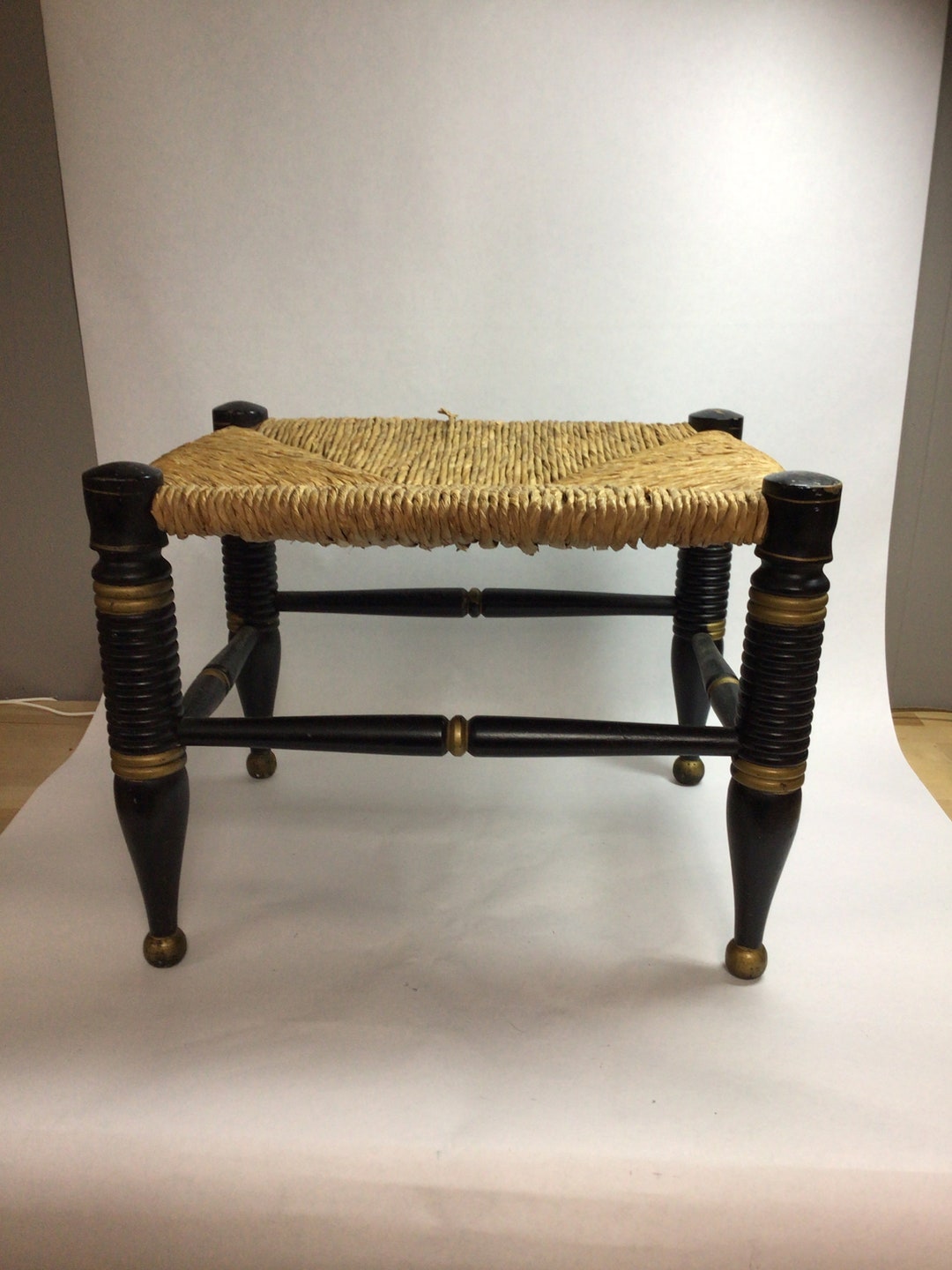 Vintage Rattan Stool Woven Seat Reed Black and Gold Legs Foot Rest - Etsy
