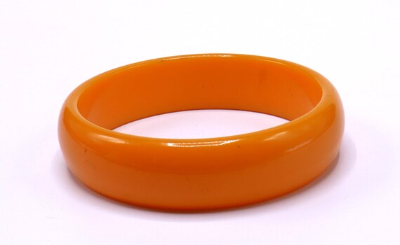 Antique vintage orange color Bakelite bangle - Gem