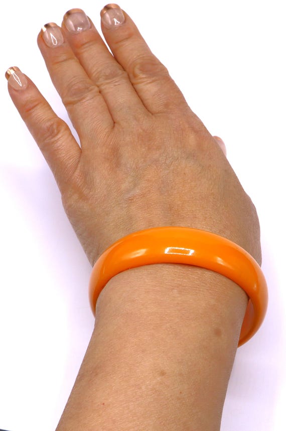 Antique vintage orange color Bakelite bangle - Gem