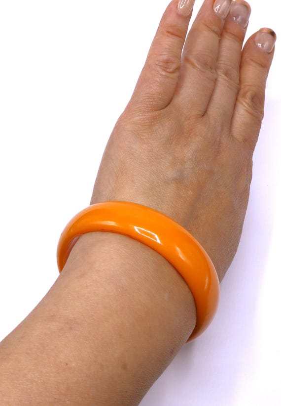 Antique vintage orange color Bakelite bangle - Gem