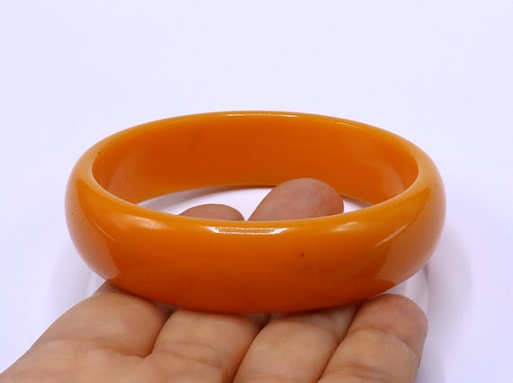 Antique vintage orange color Bakelite bangle - Gem