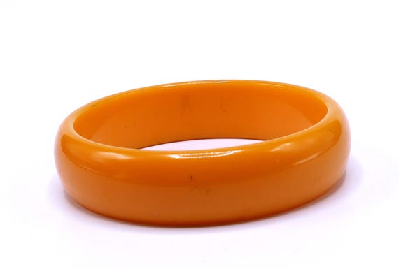 Antique vintage orange color Bakelite bangle - Gem