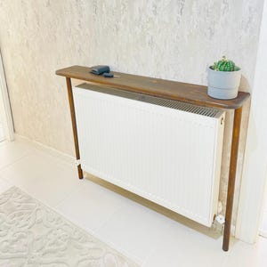 high console table over radiator