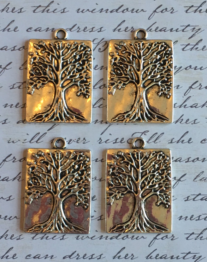 Four pewter rectangle tree of life pendents | Etsy