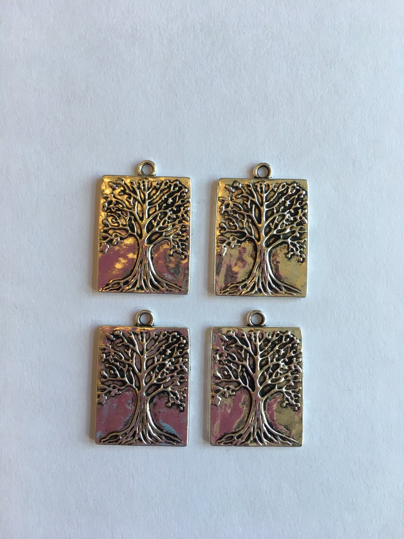 Four pewter rectangle tree of life pendents | Etsy