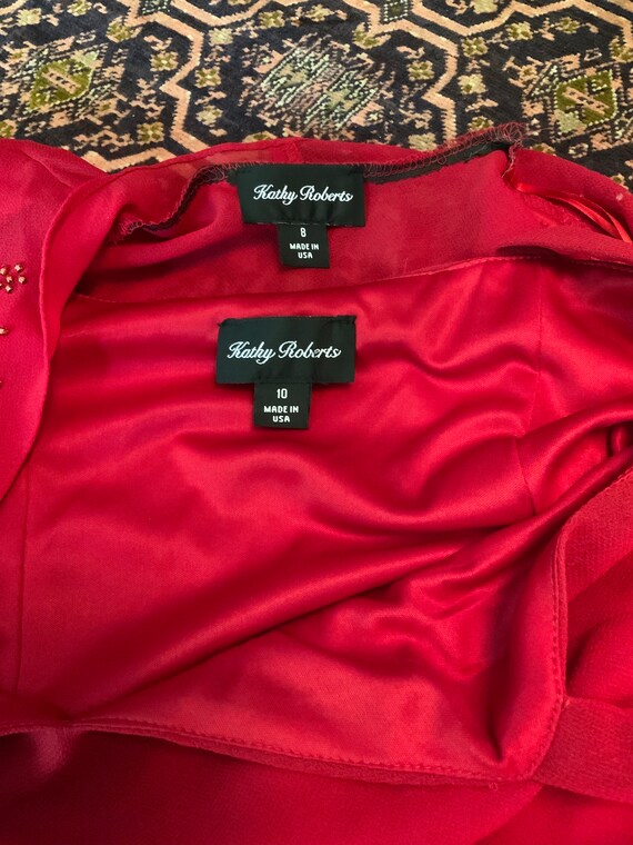 Kathy Roberts dazzling red suit with trumpet skirt an… - Gem