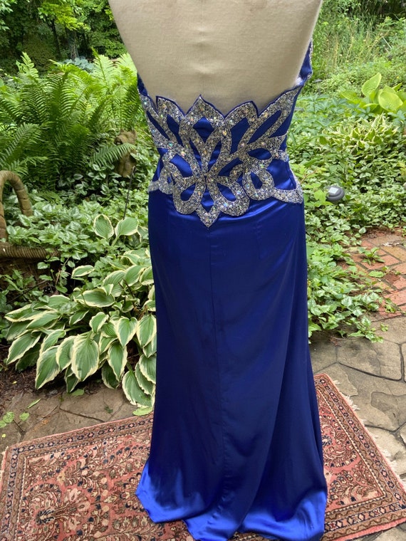 Sparkling satin halter gown in cobalt blue is a shows… - Gem