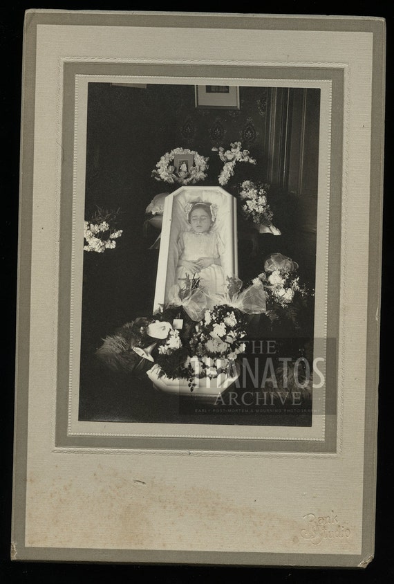 Little Girl In Casket
