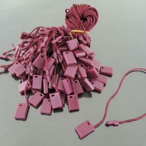 Hang Tag String - 100pcs Siam Red Hang Tag String With Plastic Fastener ...