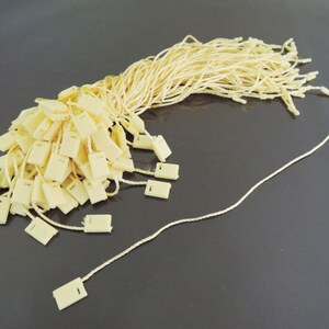 Hang Tag String - 100pcs Yellow Hang Tag String With Plastic Fastener ...