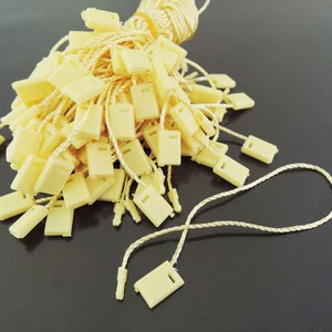 Hang Tag String - 100pcs Yellow Hang Tag String With Plastic Fastener ...