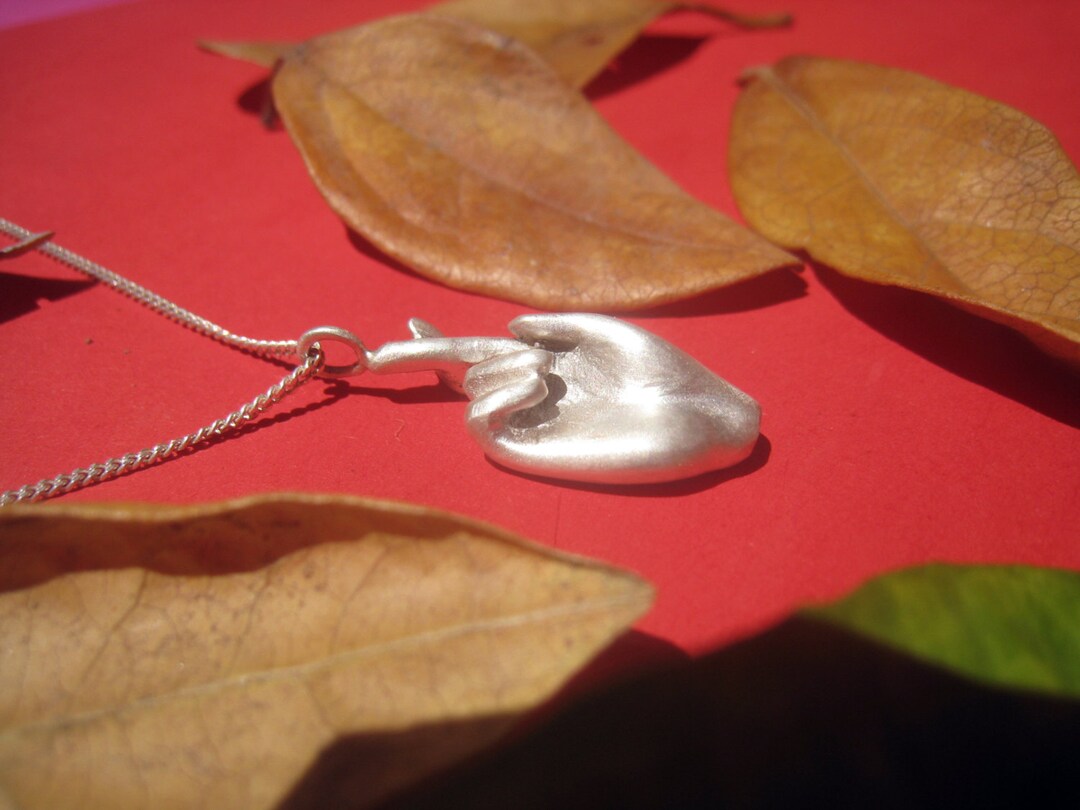 Good Luck Hand Gesture Pendant: Charming Symbol of Hope and Positivity ...