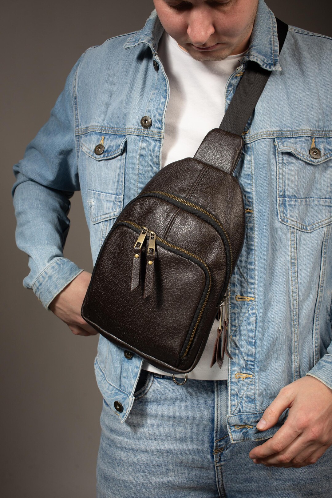 Brown Leather Sling Bag With a Long Strap and a Zippered Pocket ...