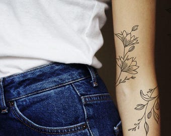 tiny ginkgo leaf tattoo