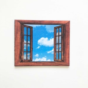 Miniature Paper Windows With View of White Clouds in a Blue Sky Two ...