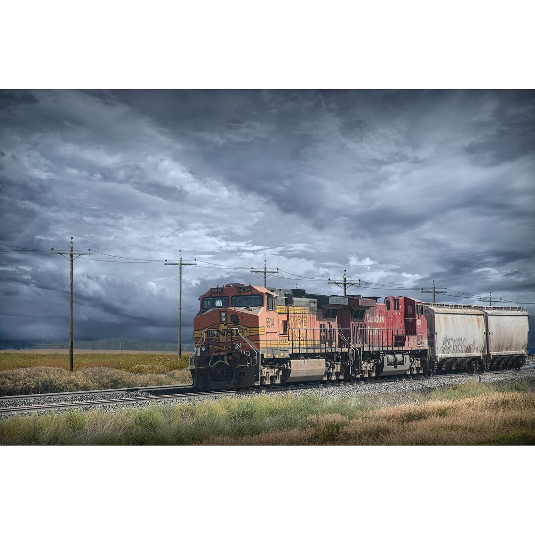 Western Train Engine on the Rails Along a Row of Utility Poles in a ...